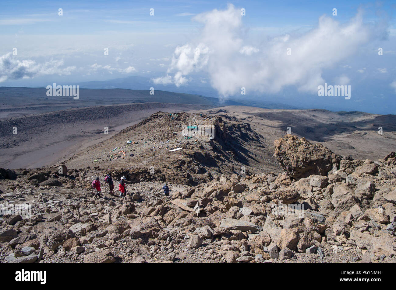 Hikers descending from Uhuru Peak with Barafu camp in the background ...