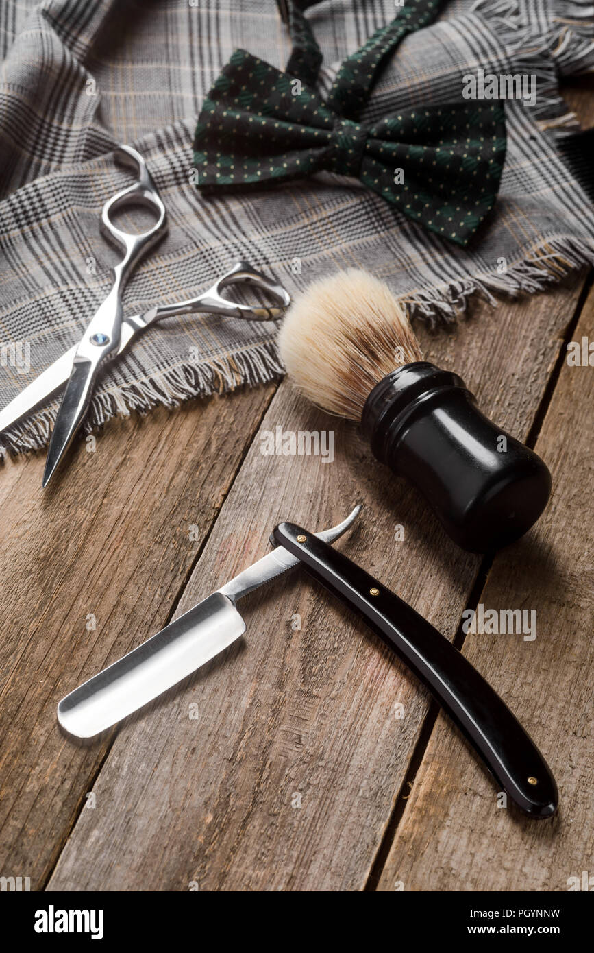 Straight razor on wooden surface Stock Photo - Alamy