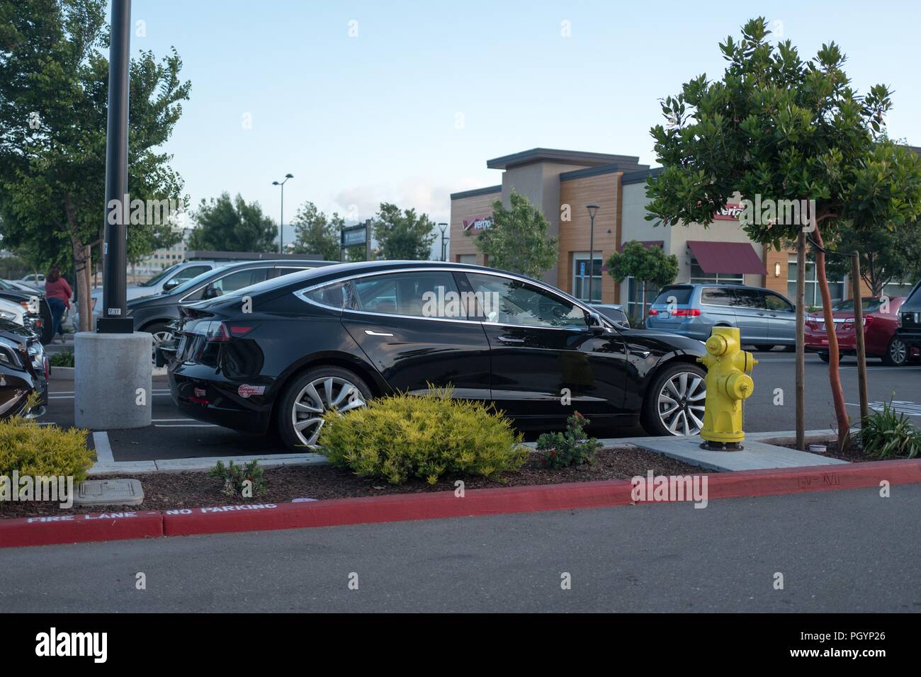 Black Tesla Model 3 electric car from Tesla Motors parked in a parking ...