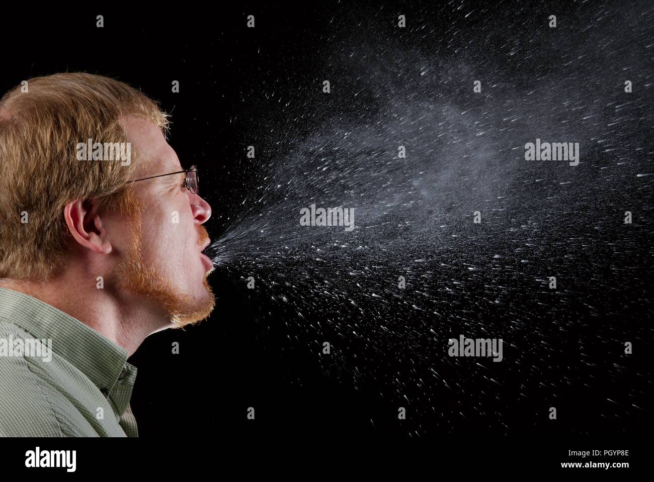 Man sneezing, depicted in a high-speed camera image, 2009. Image ...