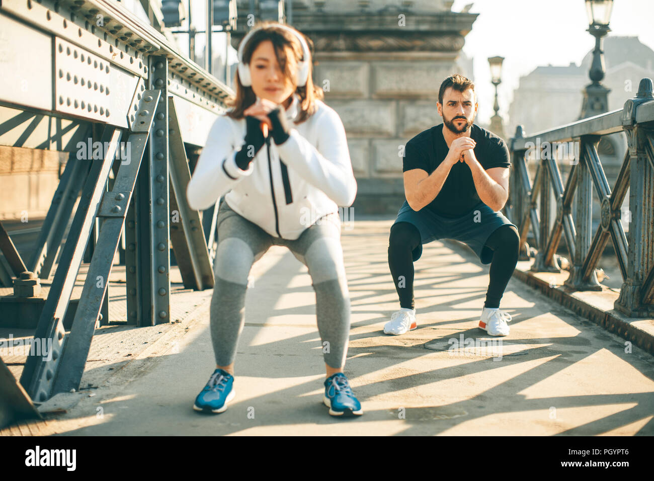 Young handsome couple have training in urban enviroment at sunny day ...