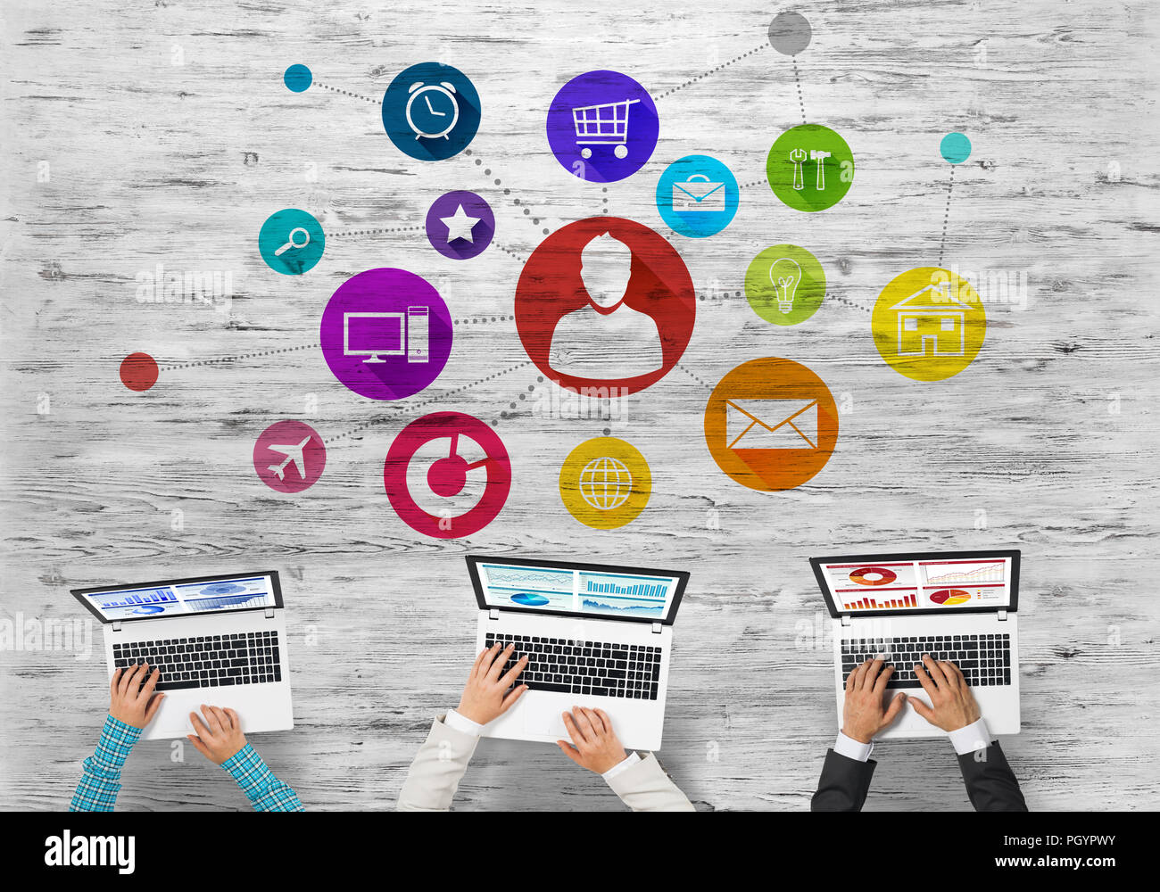 Group of three people with devices in hands working together as symbol ...