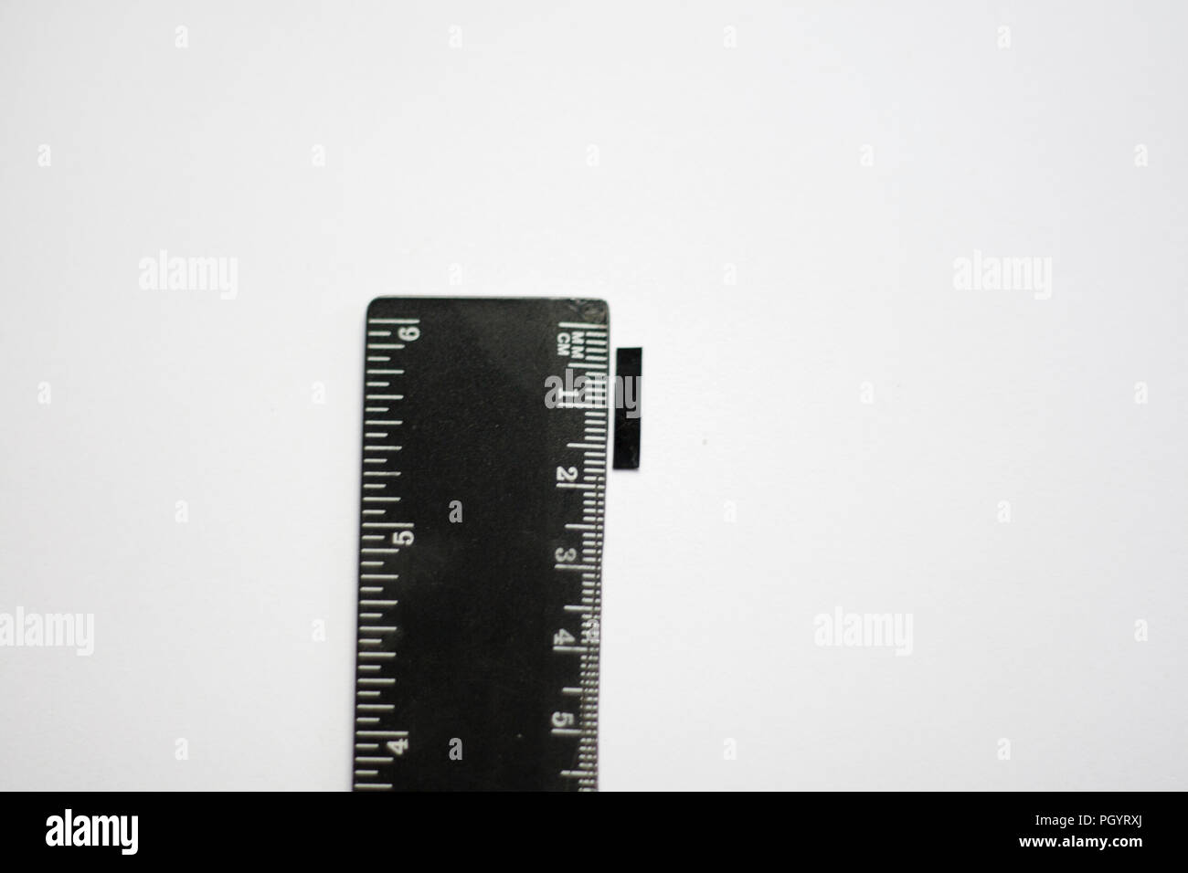 Measuring a black material Stock Photo - Alamy