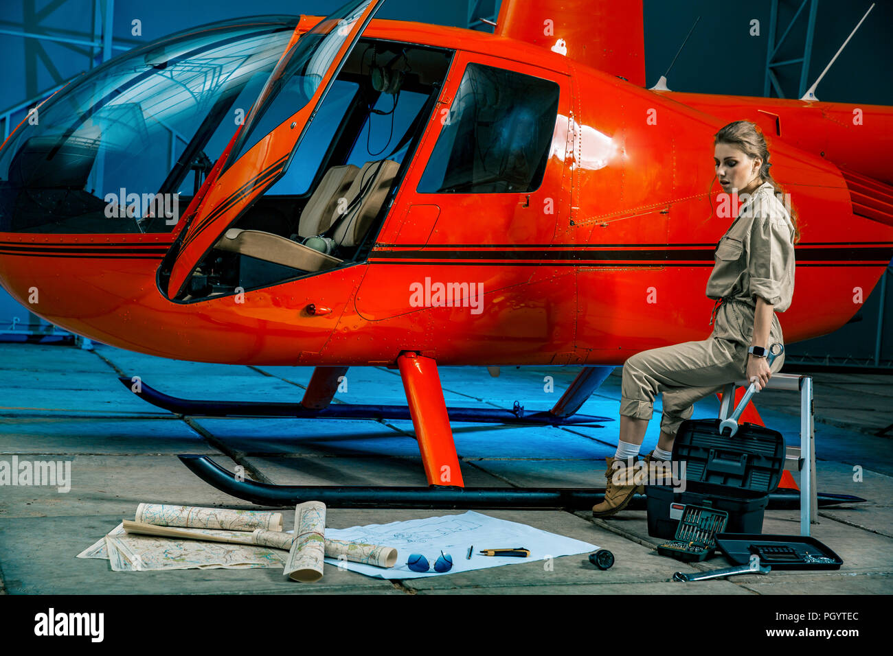 female helicopter mechanic at work. gender equality. feminism Stock ...