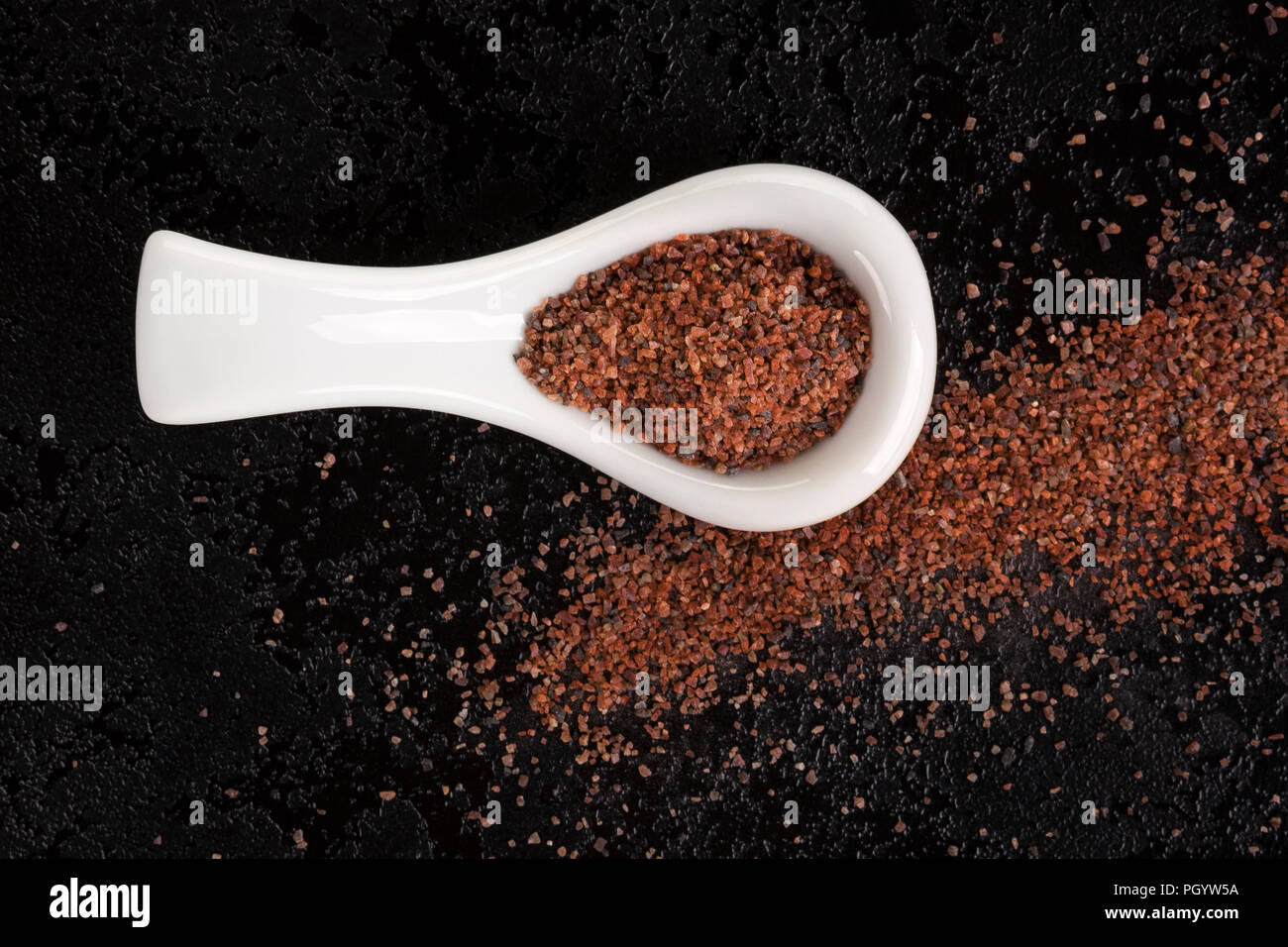Culinary himalayan salt on spoon on table Stock Photo - Alamy