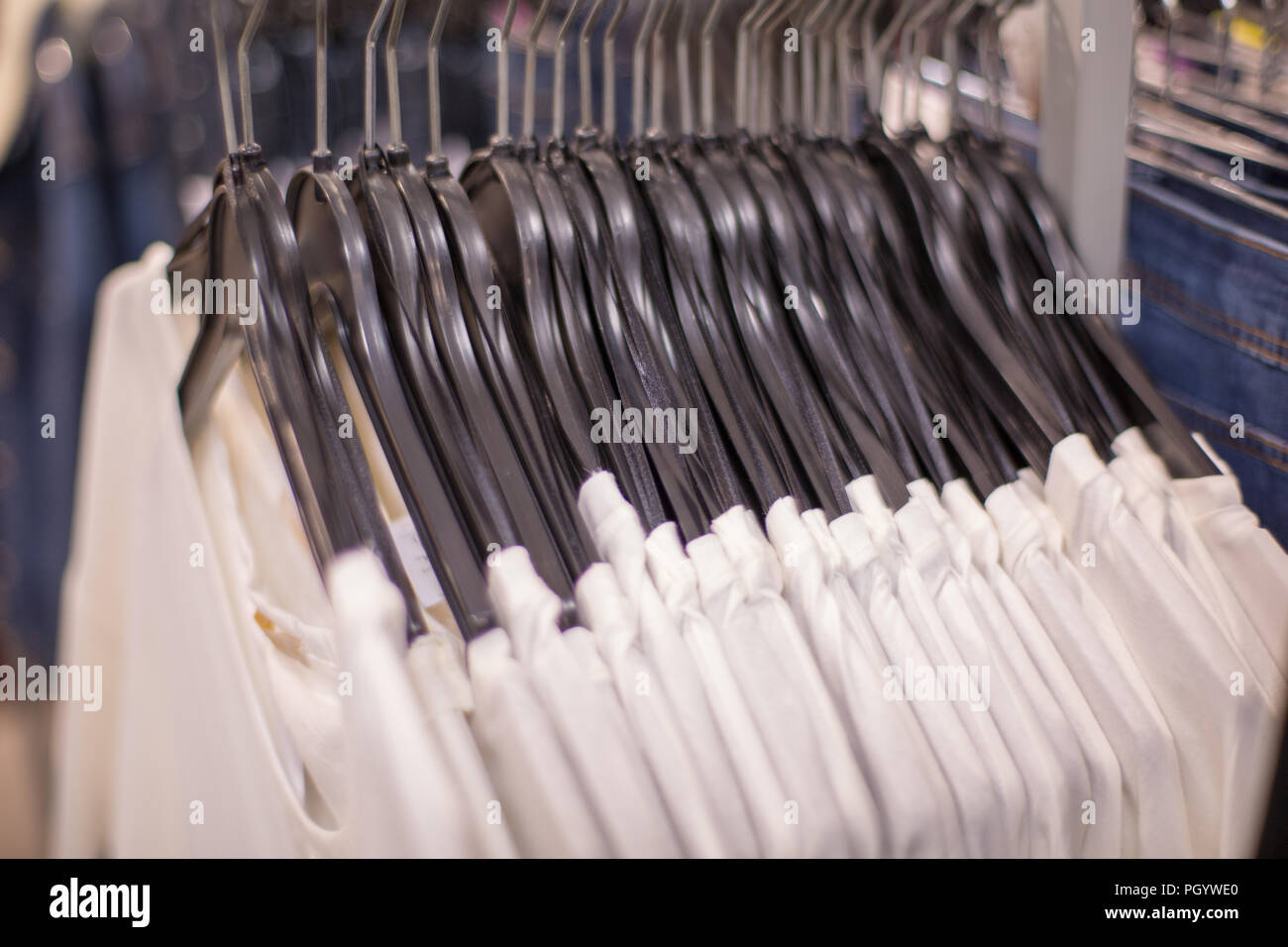 Hangers at a clothing store Stock Photo - Alamy