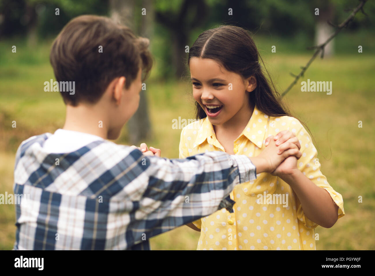 Two cute little kids having fun together Stock Photo - Alamy