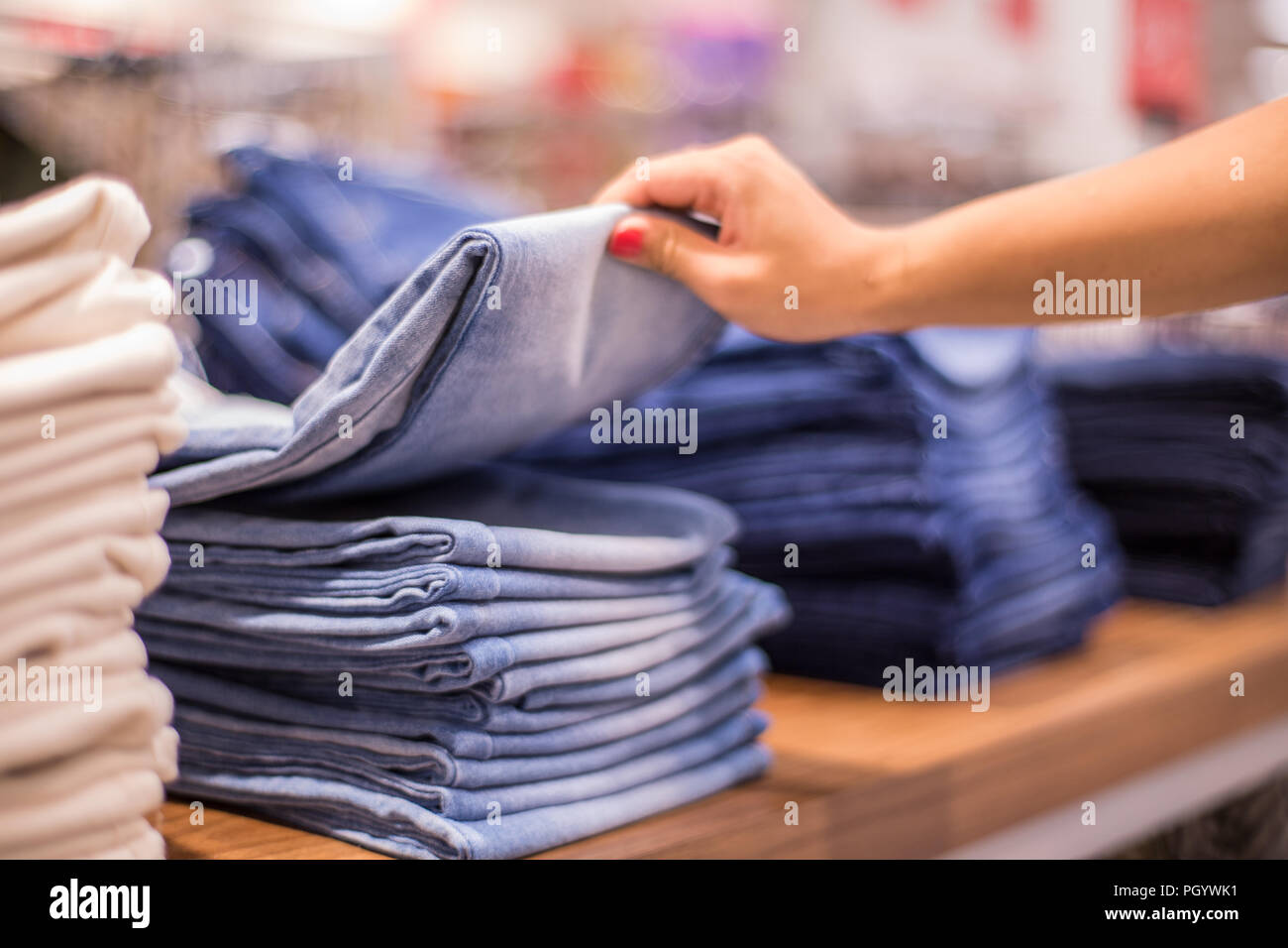 Shopping sale background theme. Jeans clothes on hanger in shop Stock ...