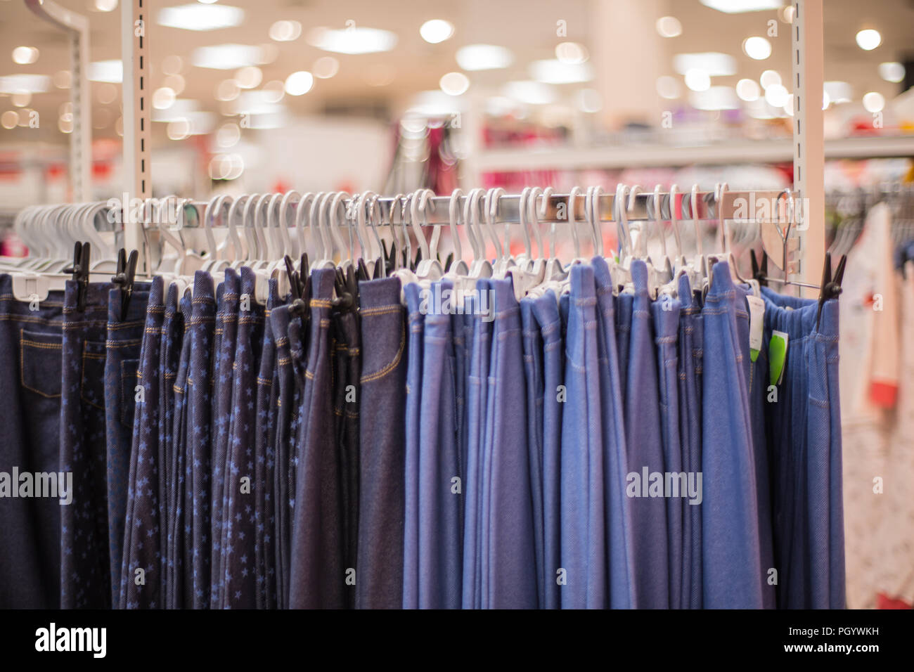 Hangers at a clothing store Stock Photo - Alamy