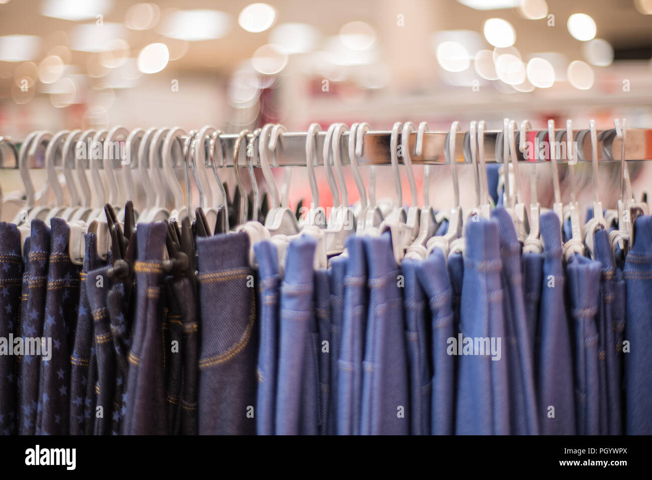 Hangers at a clothing store Stock Photo - Alamy
