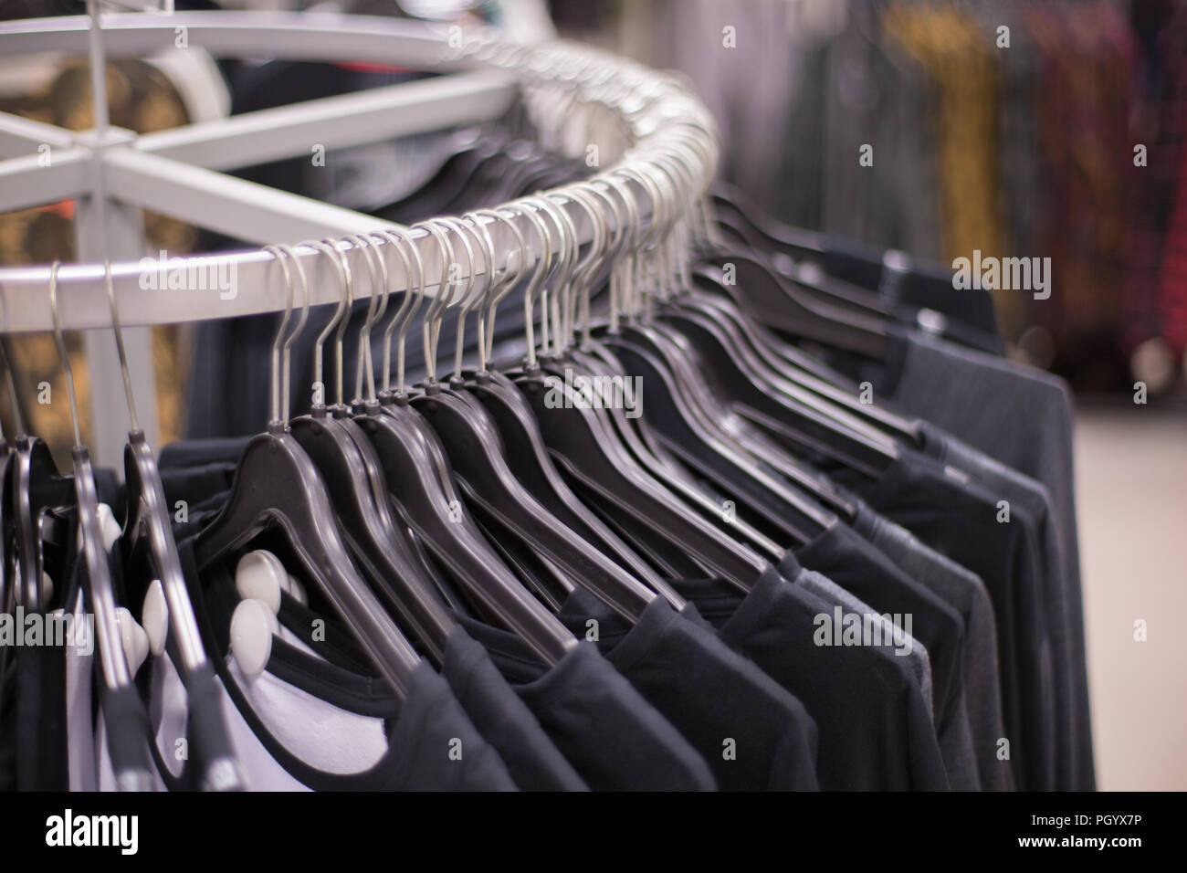 Hangers at a clothing store Stock Photo - Alamy