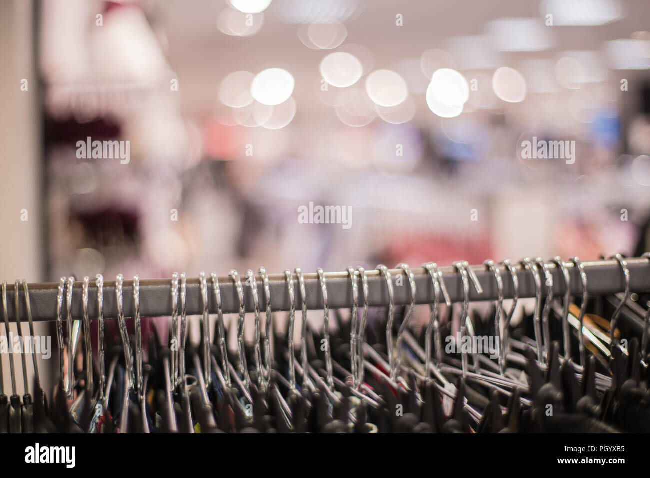 Hangers at a clothing store Stock Photo - Alamy