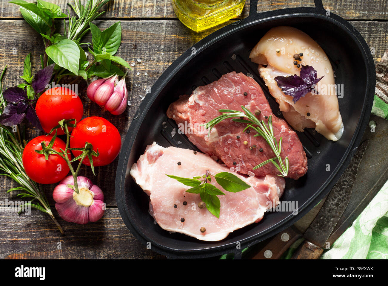 Fresh raw meat. Different types of raw pork meat, chicken fillet and ...