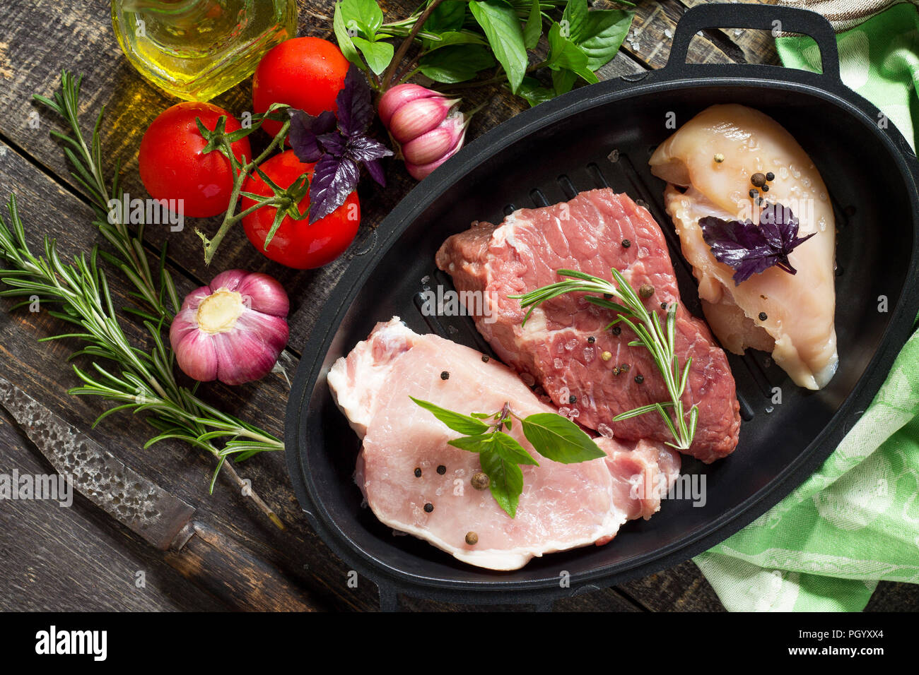 Fresh raw meat. Different types of raw pork meat, chicken fillet and ...
