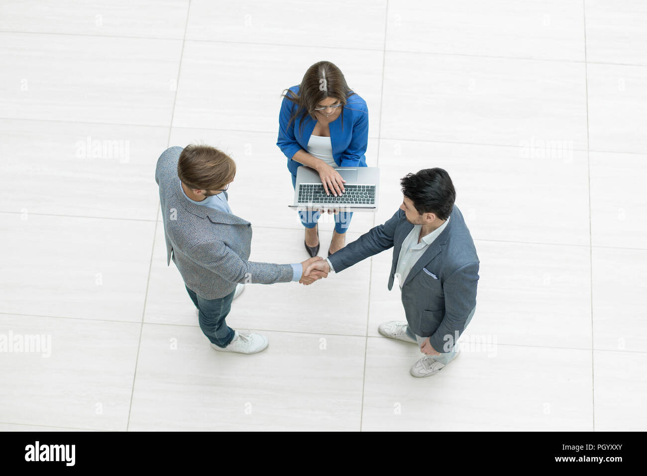 top view.business people shaking hands Stock Photo - Alamy