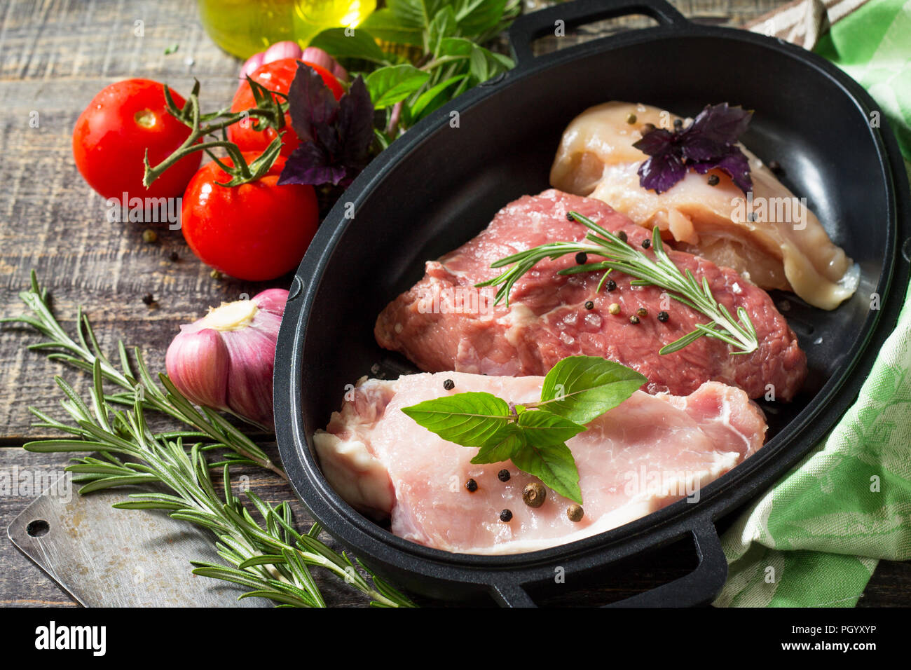 Fresh raw meat. Different types of raw pork meat, chicken fillet and ...