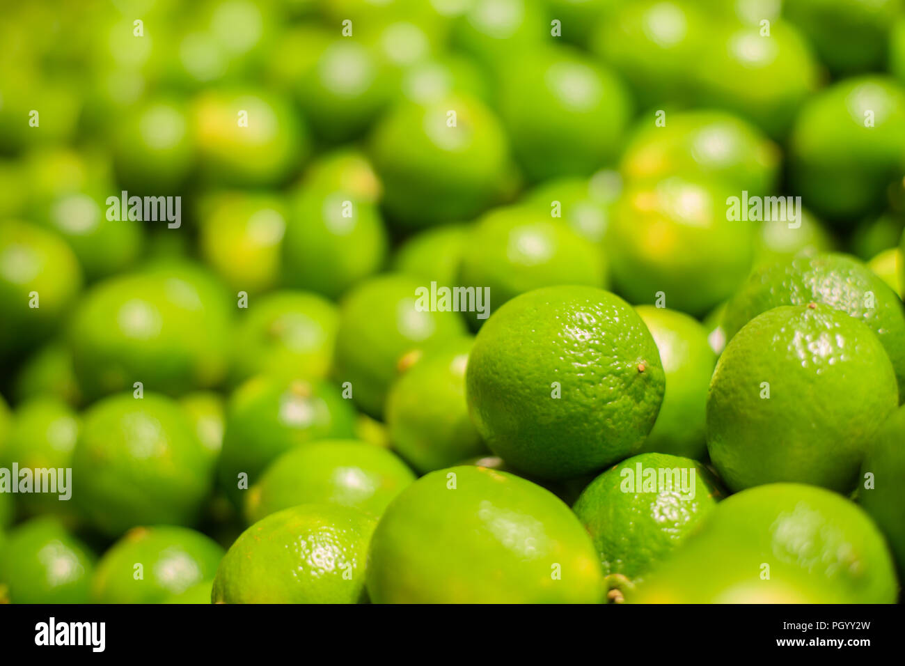 Fresh green lemons in supermarket Stock Photo - Alamy