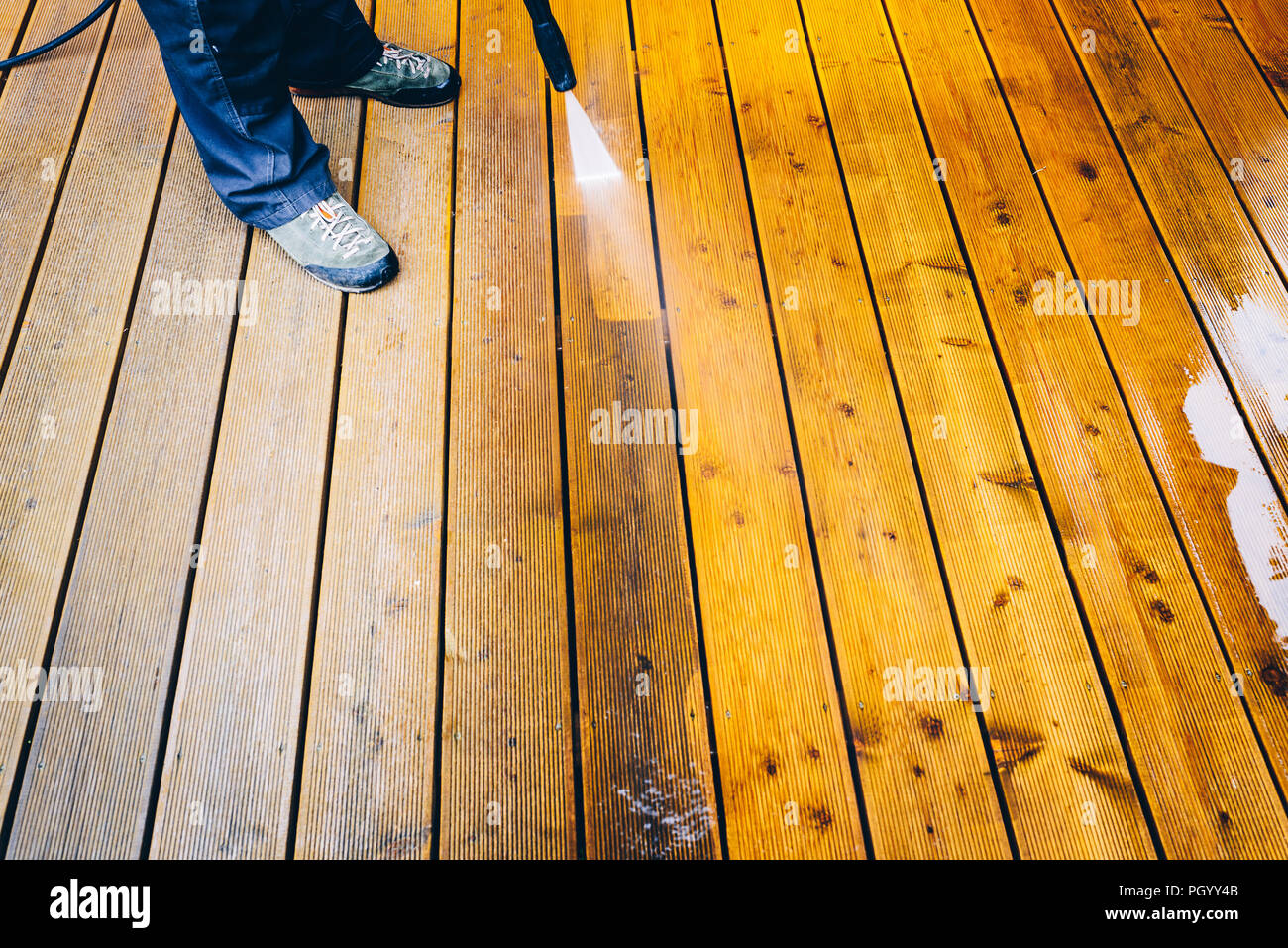 cleaning terrace with a power washer - high water pressure cleaner on ...