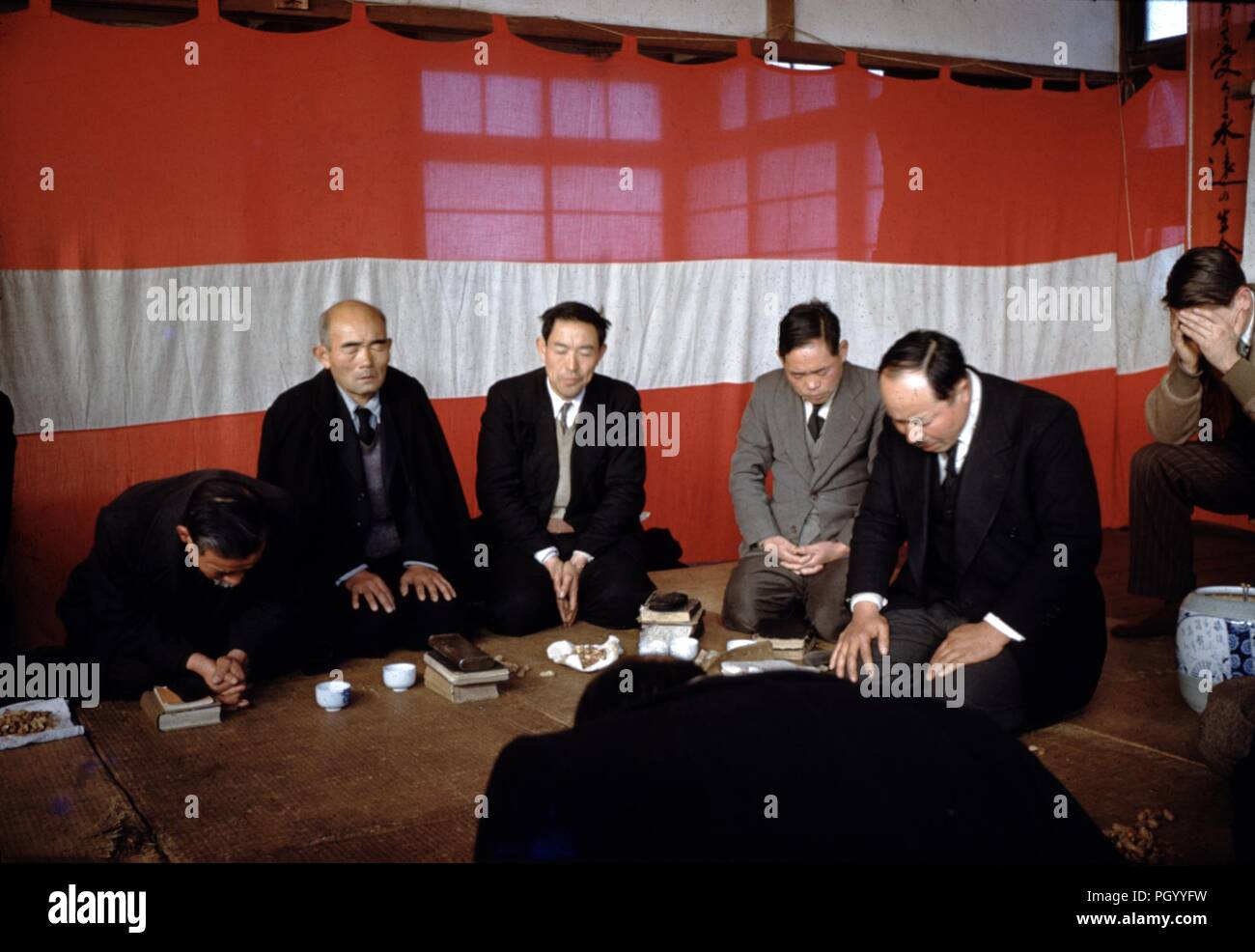 Bowing their heads in prayer hi-res stock photography and images - Alamy