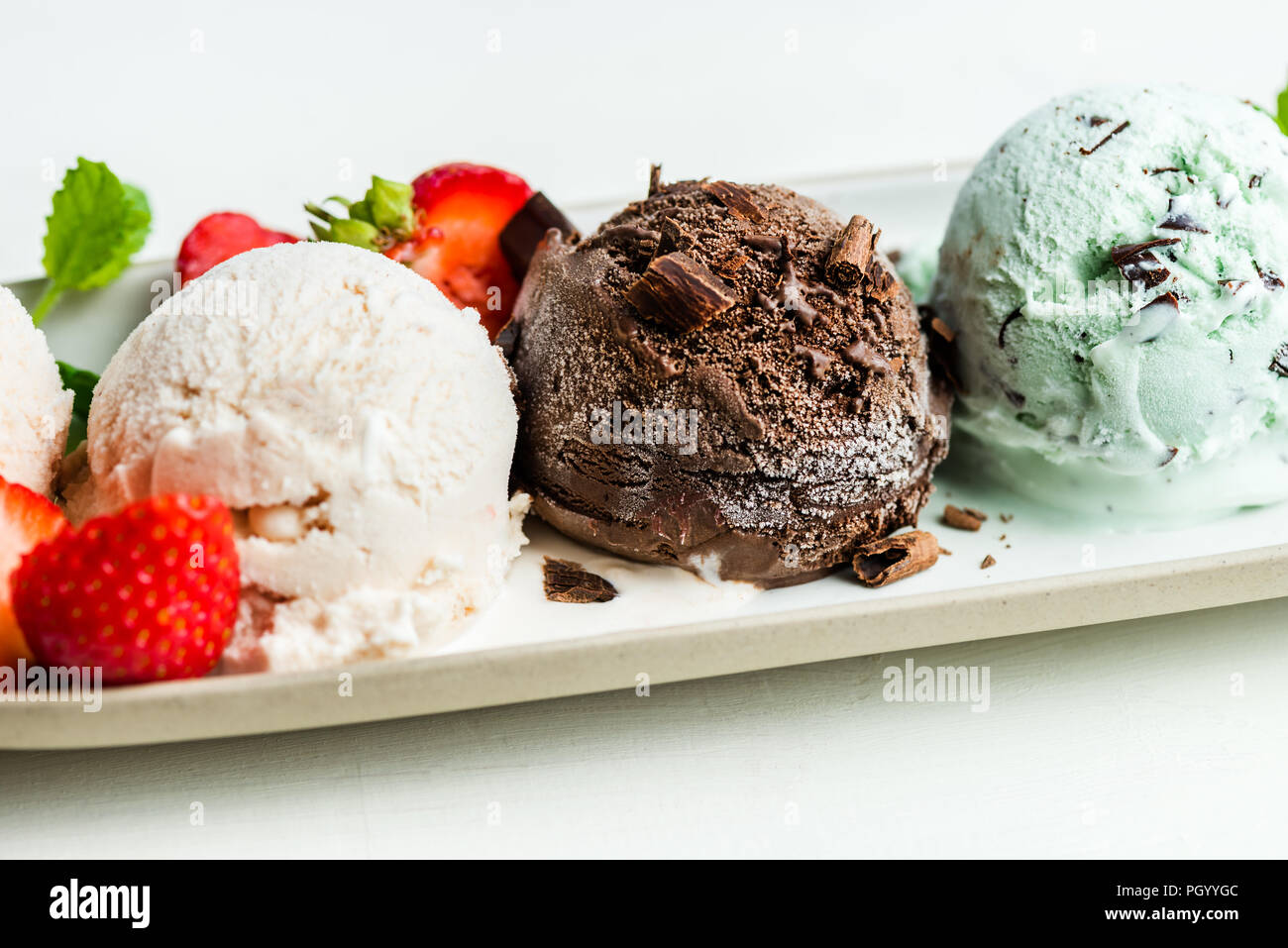 Selection of different ice cream scoops such as mint, chocolate and ...