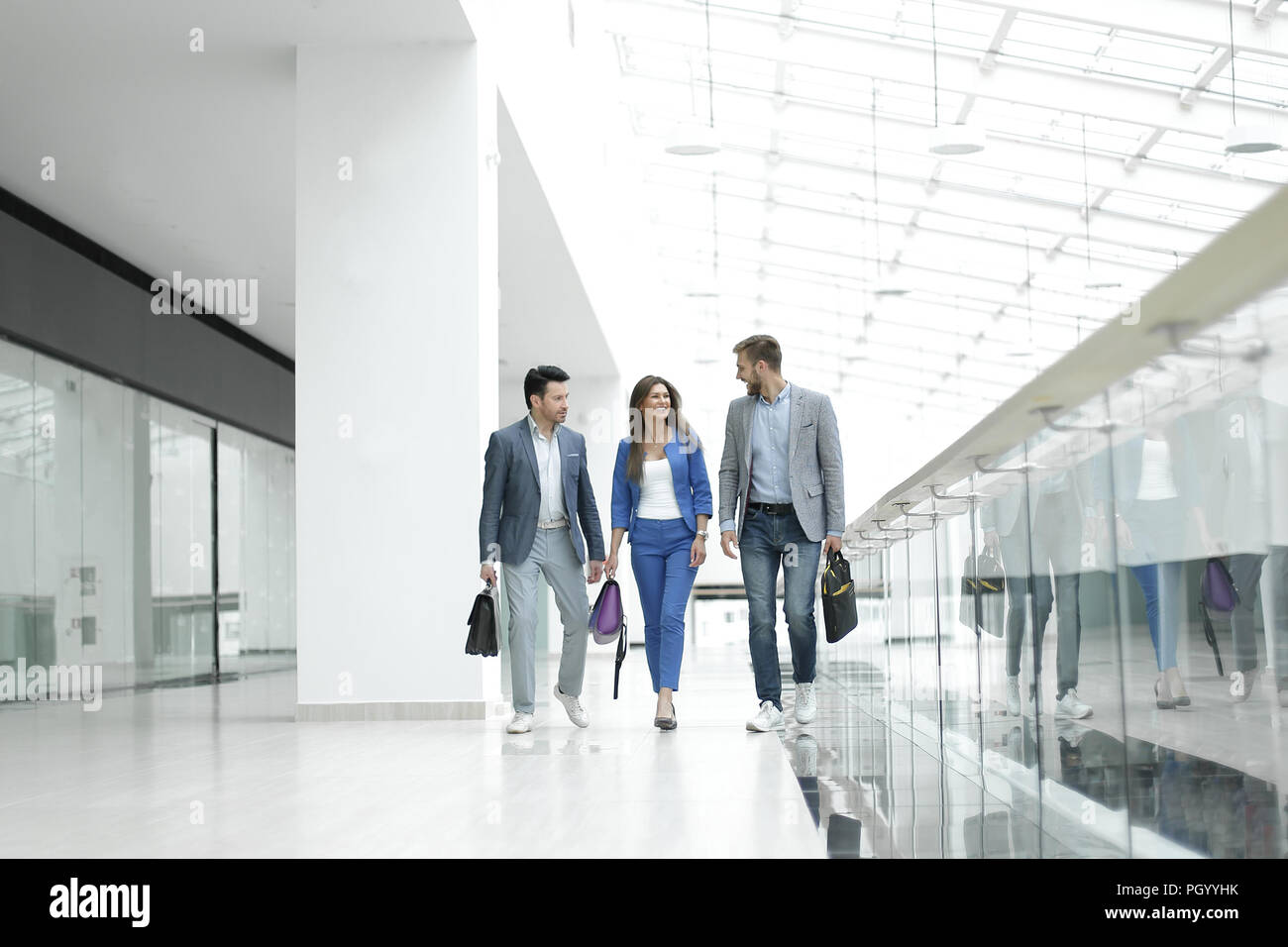 visitors walk in the lobby of the business center Stock Photo - Alamy