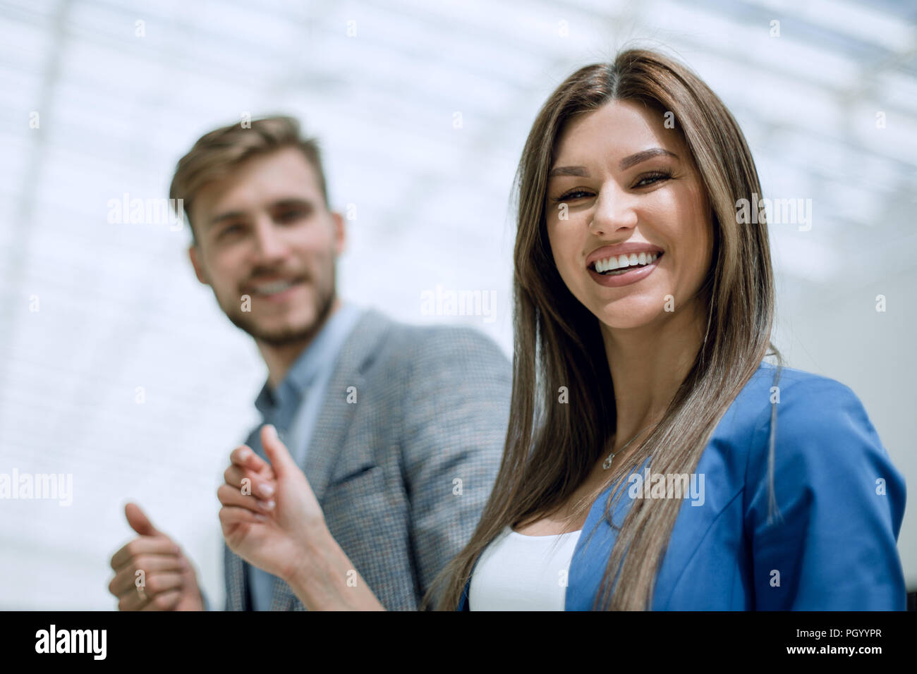 close up.confident business couple standing in the office Stock Photo ...