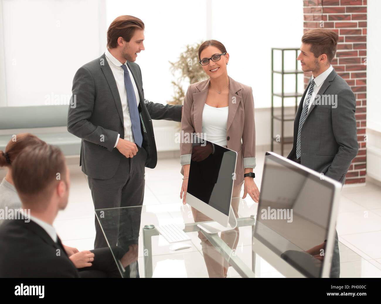 business team talking near the desktop Stock Photo - Alamy