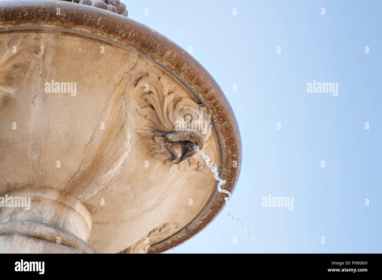 Top of old Euro style water fountain with fish spouting water Stock ...