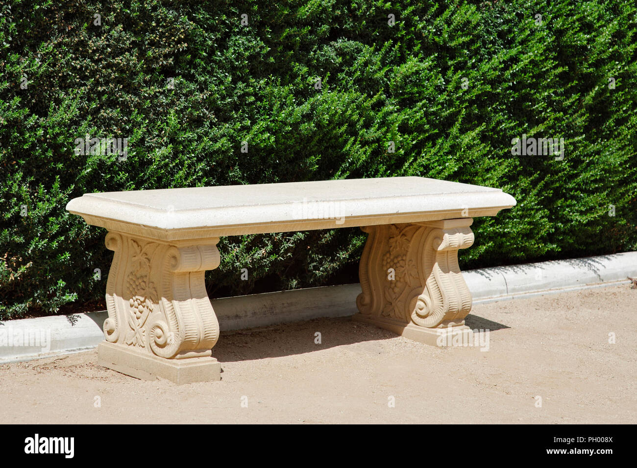 Angled view of stone park bench with copy space Stock Photo - Alamy