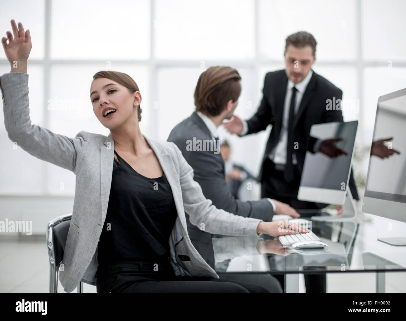 young employee sitting at his Desk Stock Photo - Alamy