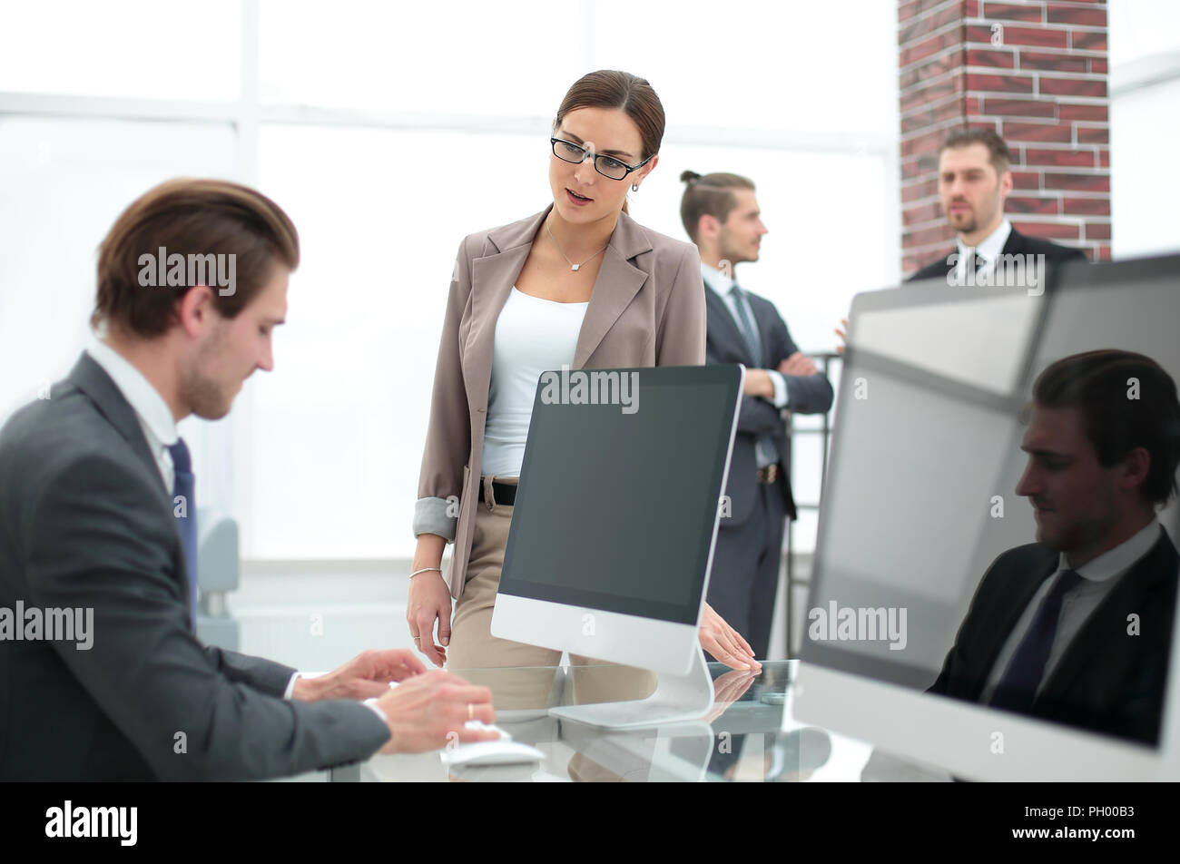 woman Manager standing near the Desk Stock Photo - Alamy