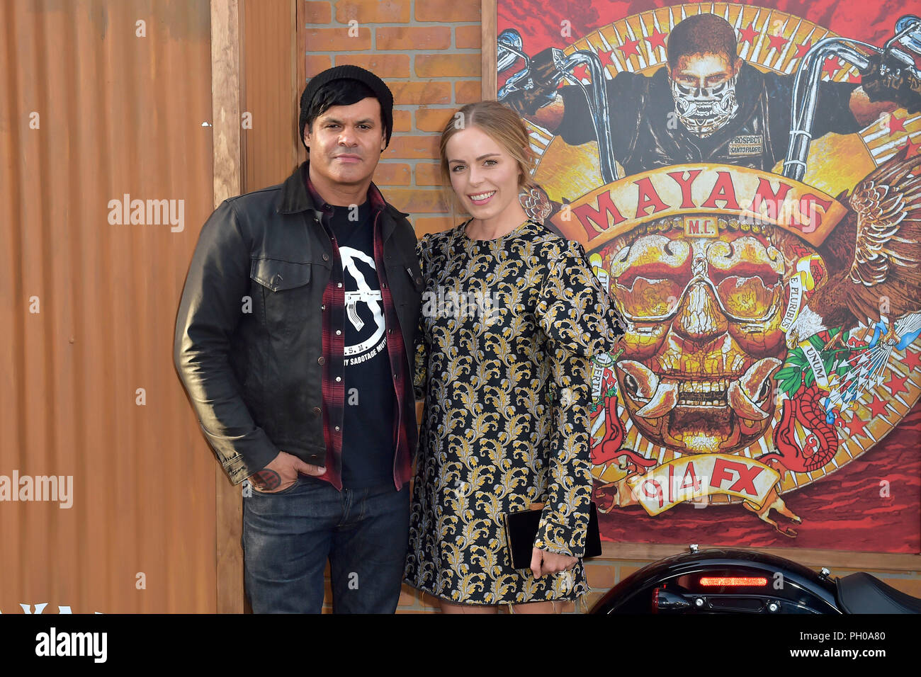 Elgin James and Gttin Liz attending the premiere of FX's 'Mayans M.C ...