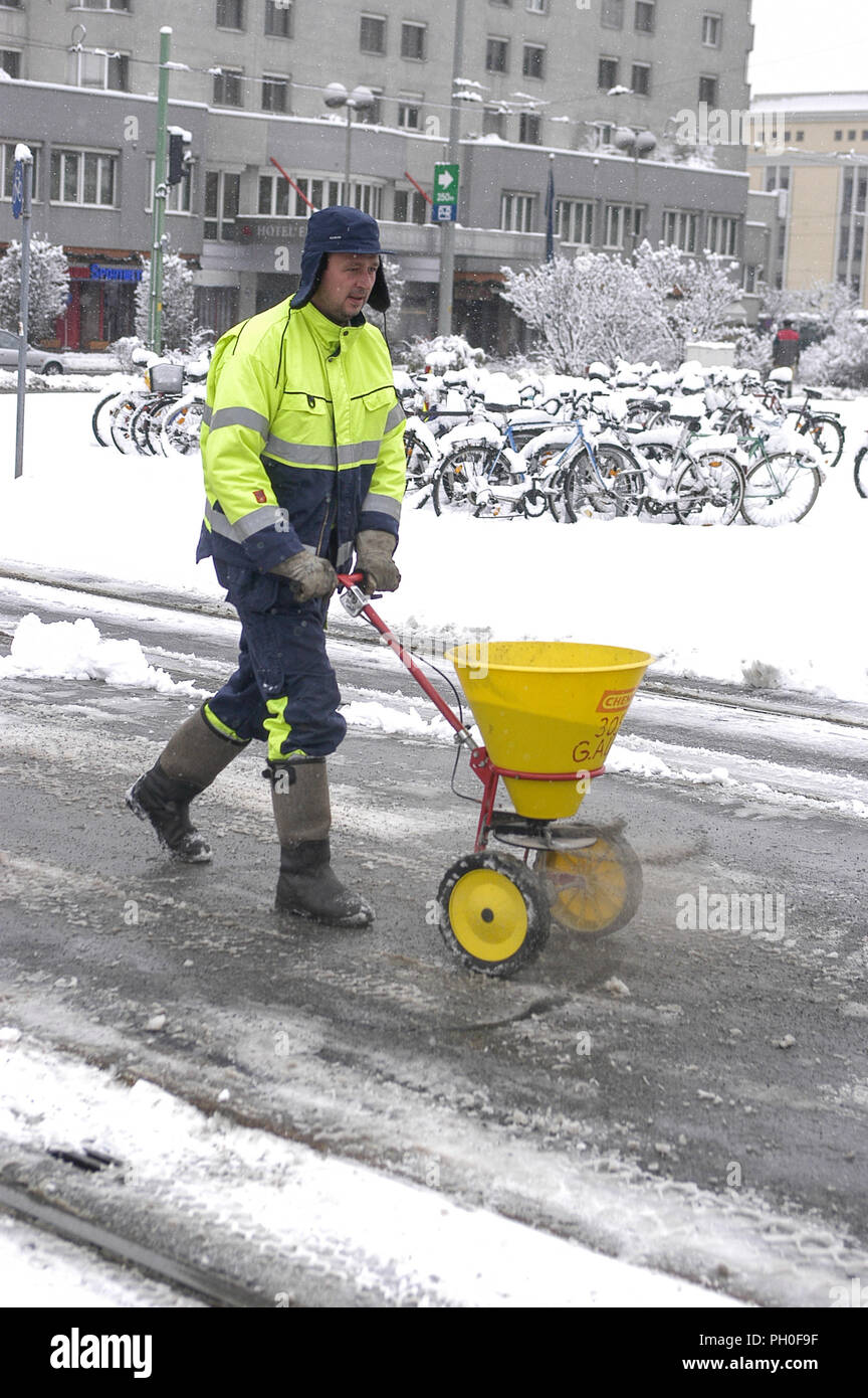 A council worker clearing snow using his mobile snow gritter in the ...