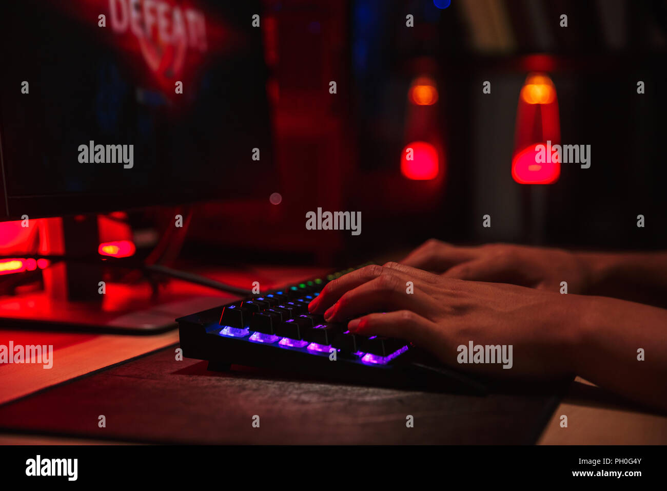 Hands of young gamer man losing while playing video games on computer ...