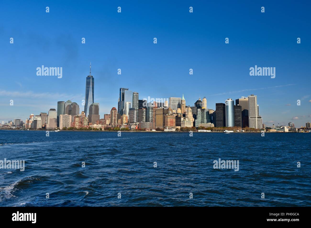 Manhattan cityscape as seen from a boat in upper bay Stock Photo - Alamy