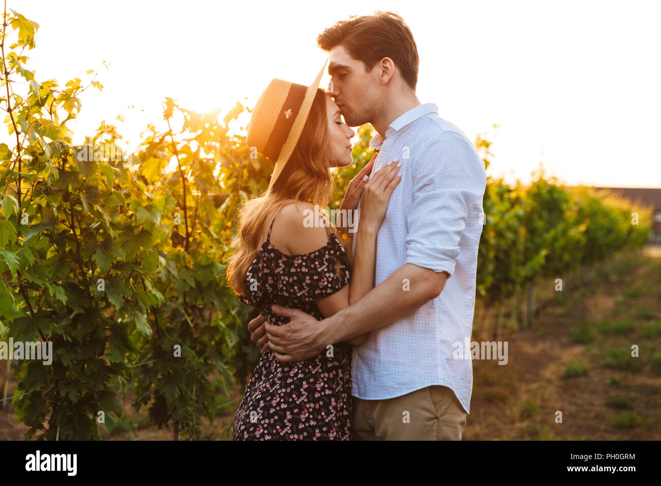 Photo of young cute loving couple outdoors hugging with each other ...