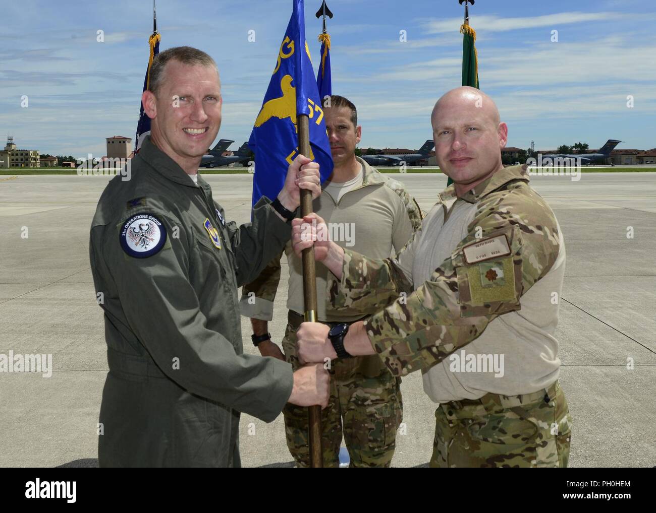 Col. Richard Nelson, 31st Operations Group commander, passes the guidon ...