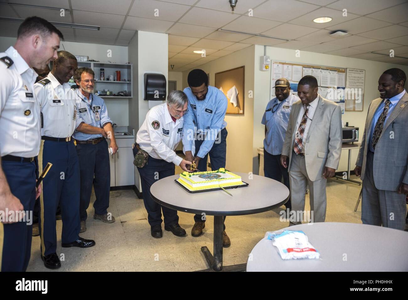 Arlington National Cemetery employees John Gandy (center left) facility ...