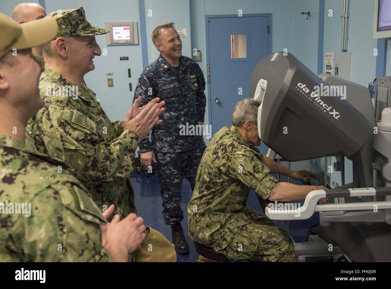 Japan (June 14, 2018) Vice Adm. Phillip Sawyer (center), commander, U.S. 7th Fleet, uses the Da ...