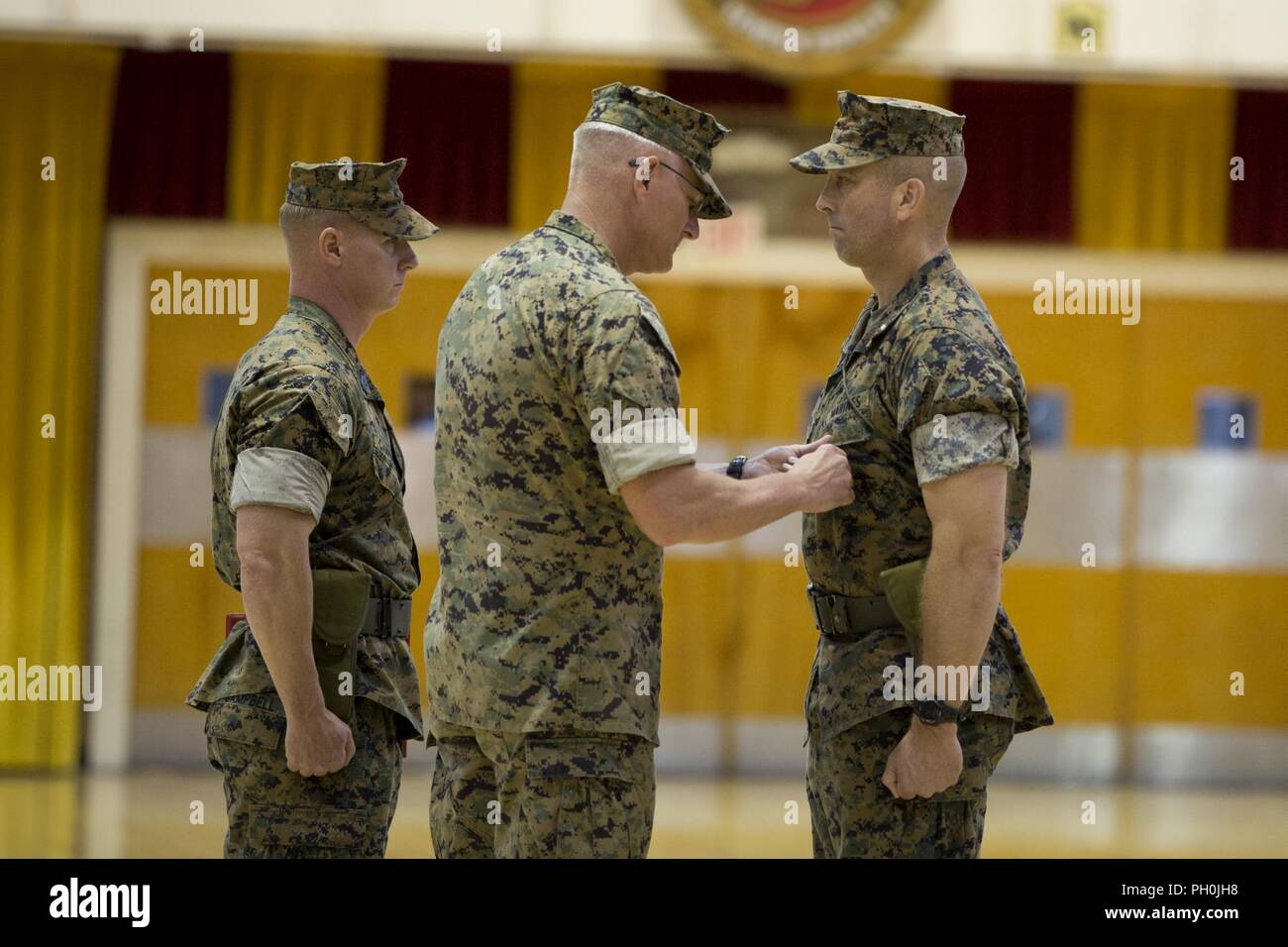 U.S. Marine Corps Col. Christian Cabaniss, center, the assistant ...
