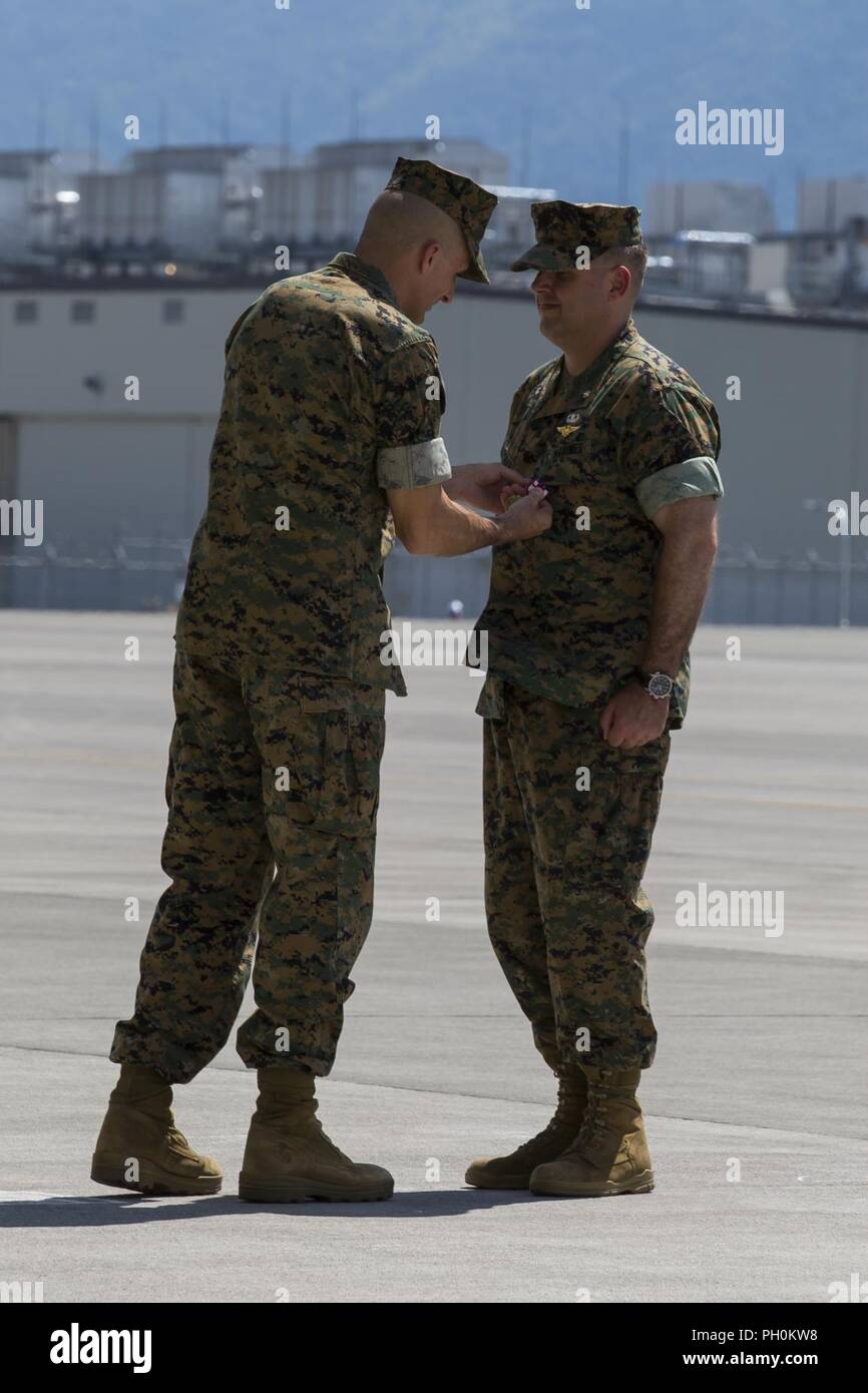 U.S. Marine Corps Col. Mark Palmer, left, commanding officer of Marine ...