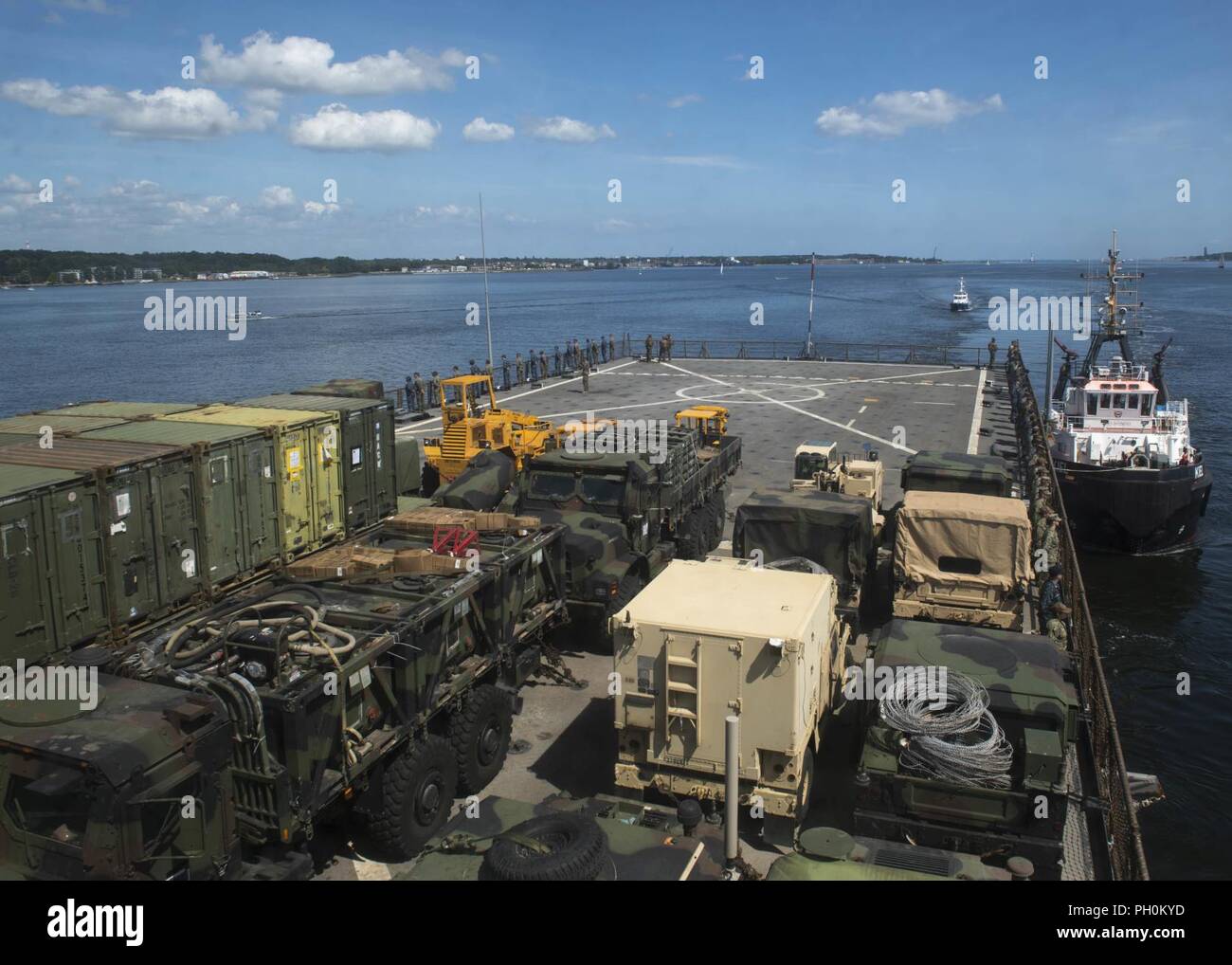 SEA (June 15, 2018) Sailors and Marines aboard the Harpers Ferry-class ...
