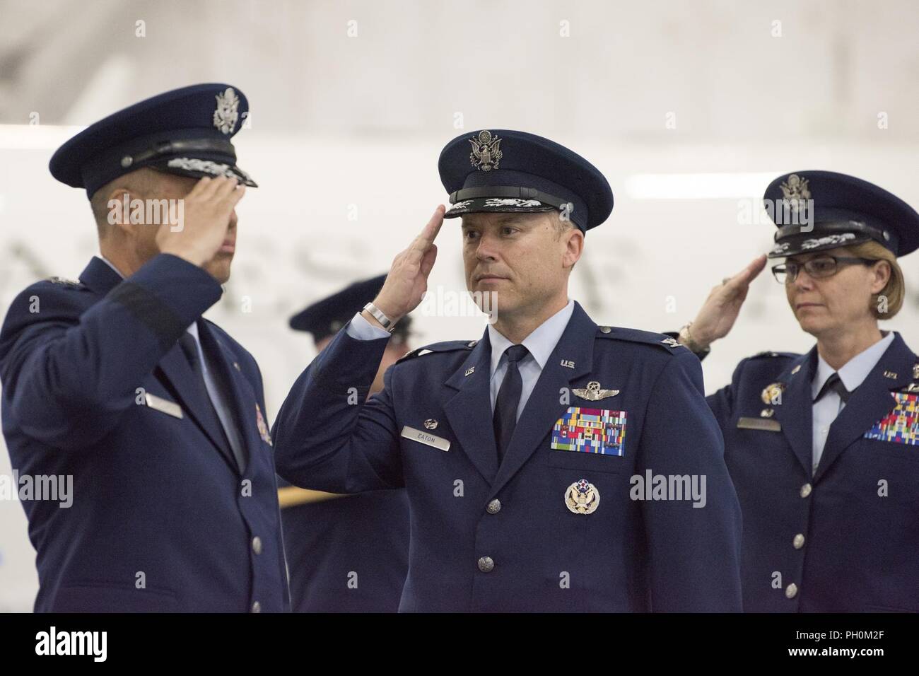 Col. Casey Eaton renders a salute to Lt. Gen. GI Tuck, 18th Air Force ...