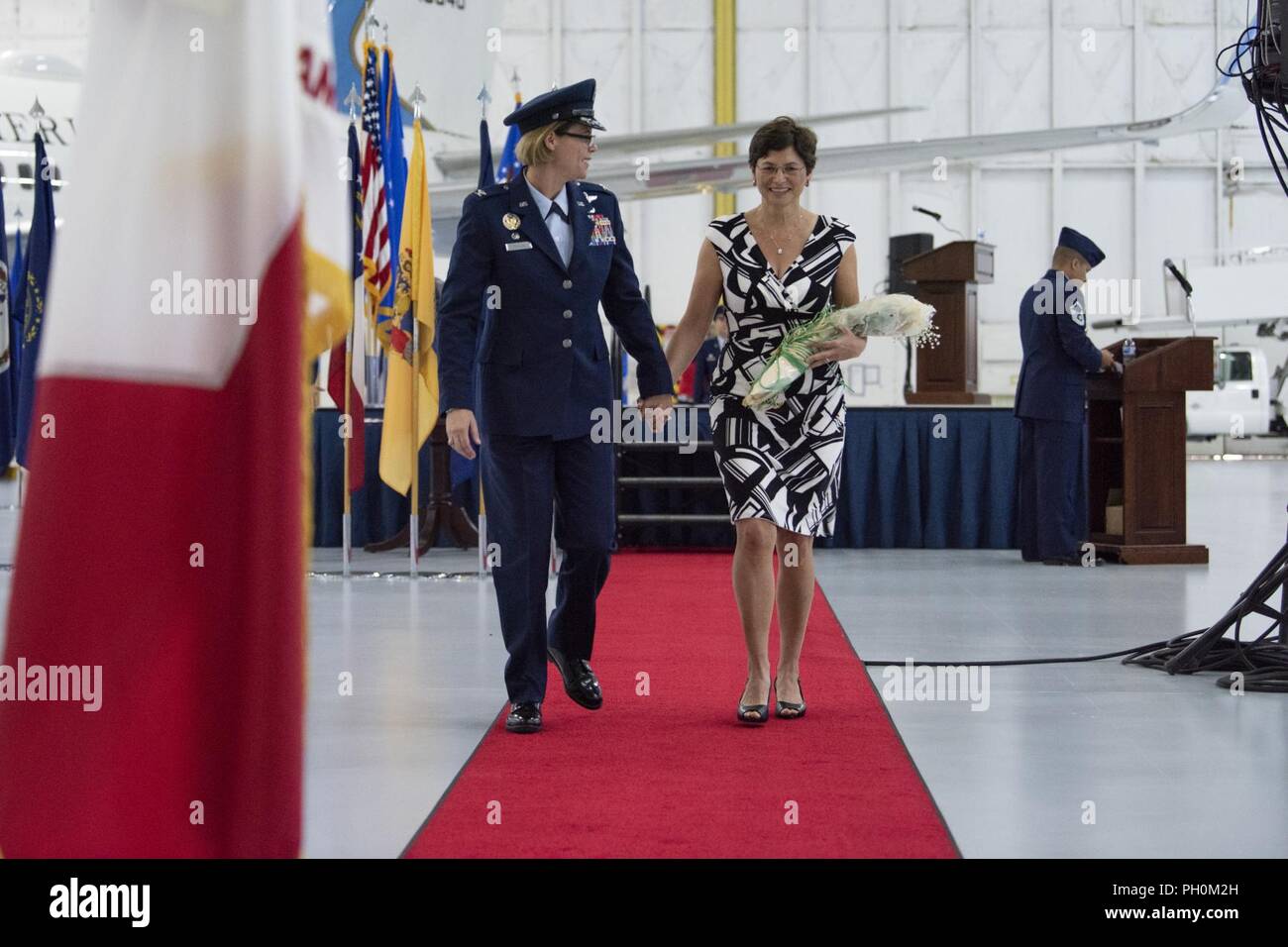 Col. Rebecca Sonkiss, 89th Airlift Wing commander, walks with her wife ...