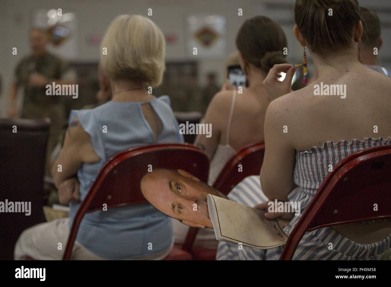 A family member holds a parting memento of U.S. Marine Corps Brig. Gen ...