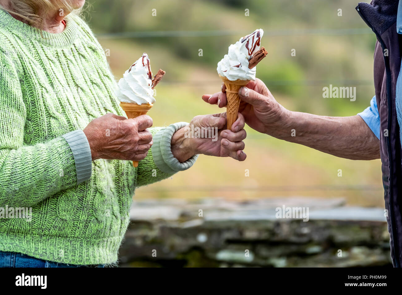 Elderly woman eating ice cream hi-res stock photography and images - Alamy