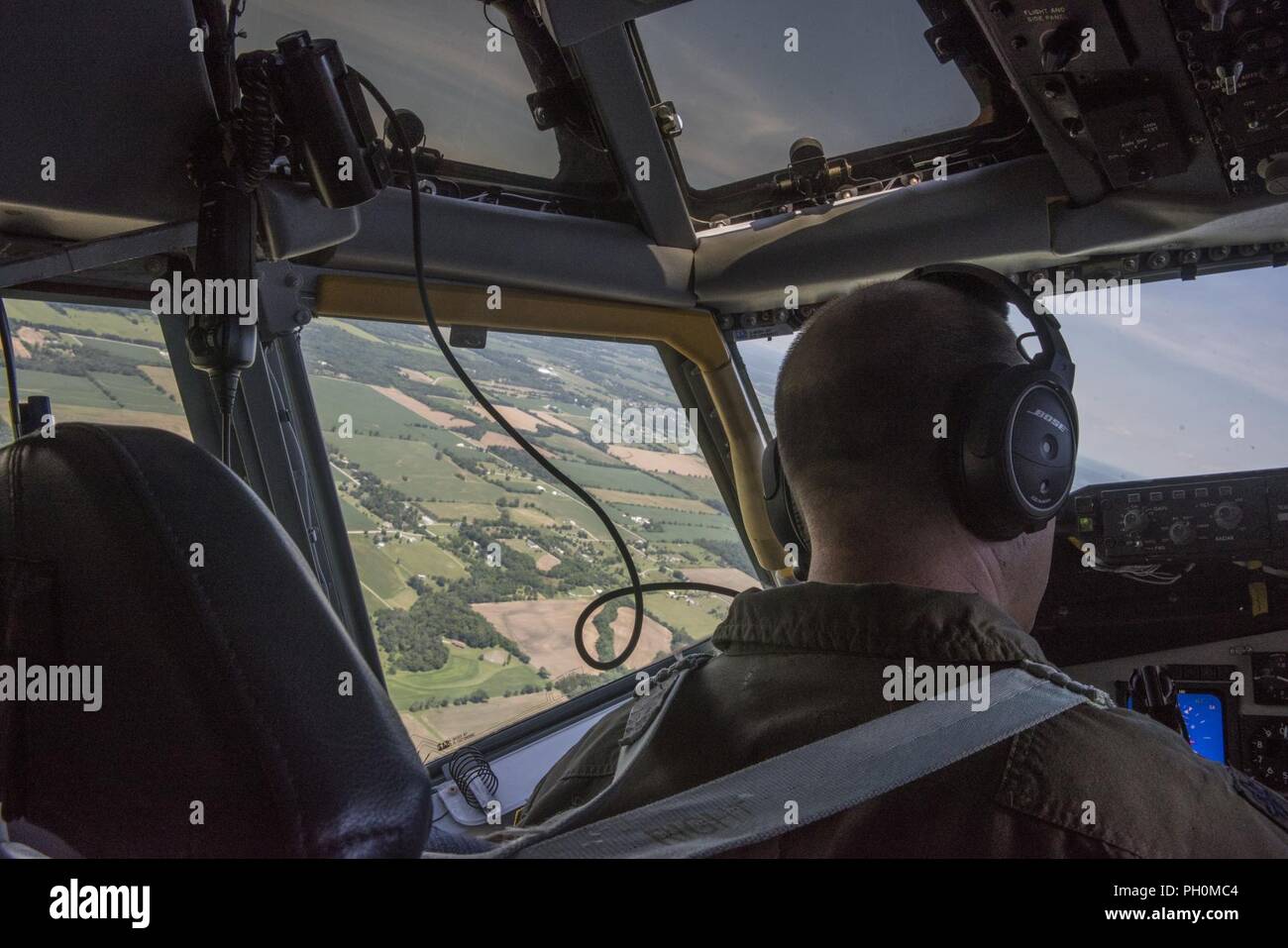 A pilot from the 121st Air Refueling Wing, Ohio looks at the control ...
