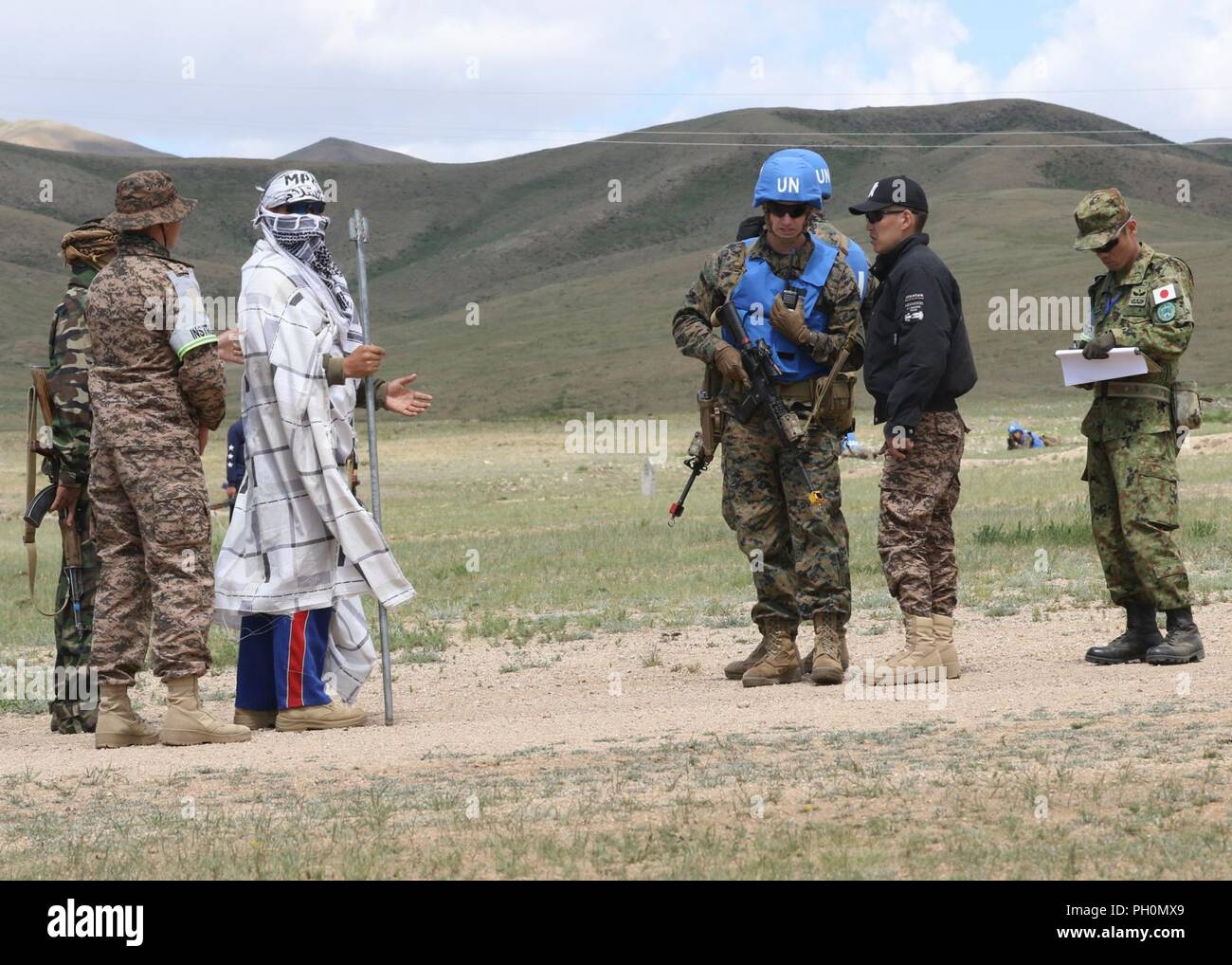 U.S. Marine Corps Forces Pacific Marines speak with civilians with the ...