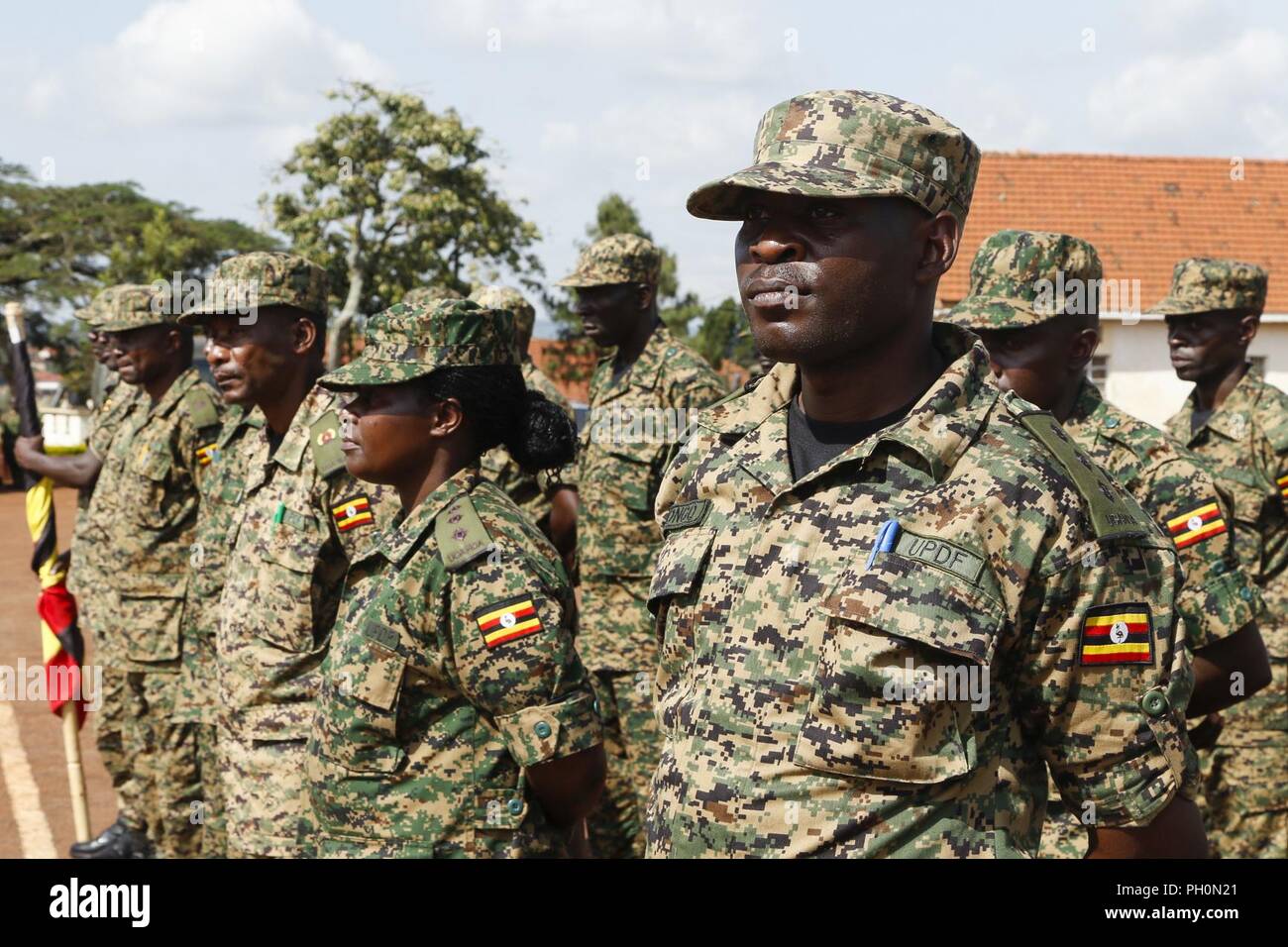 Uganda People’s Defence Force soldiers stand in formation at the ...