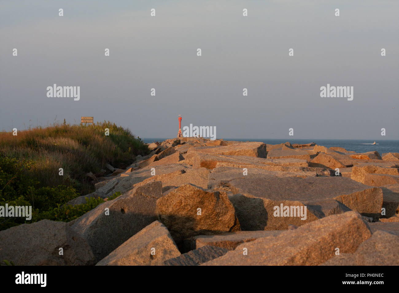 Rock outcrop to the ocean Stock Photo - Alamy